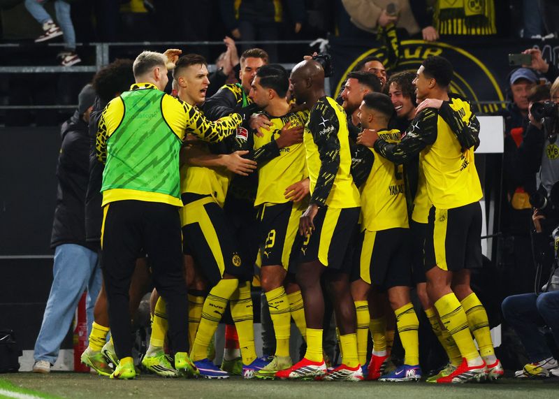 Soccer-Dortmund waste two-goal lead but score stoppage-time win over St ...