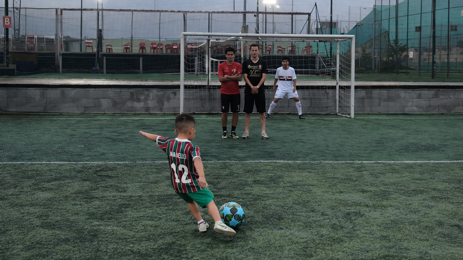 Will this kid score the free kick?