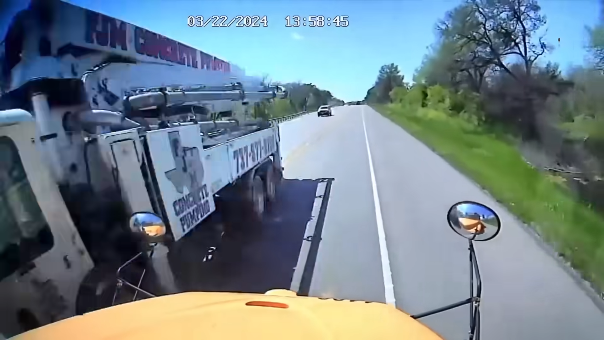 A truck hit a school bus and it rolled over