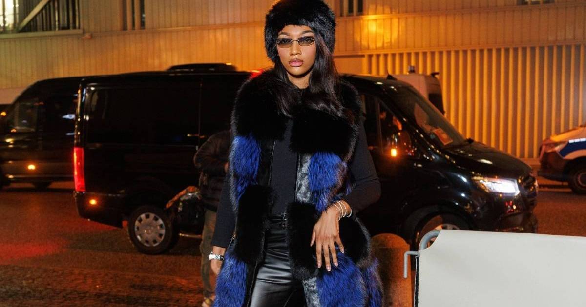 Angel Reese is giving mob wife in animal print minidress & fur coat