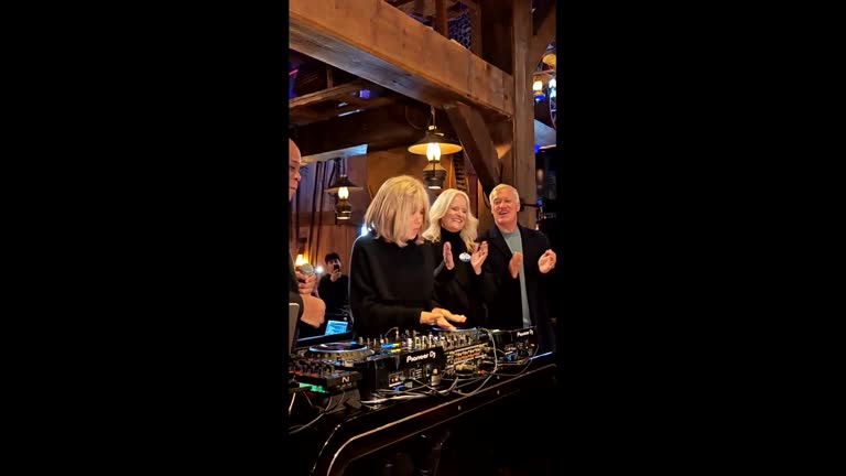 France's Brigitte Macron and Didier Deschamps DJ at charity event