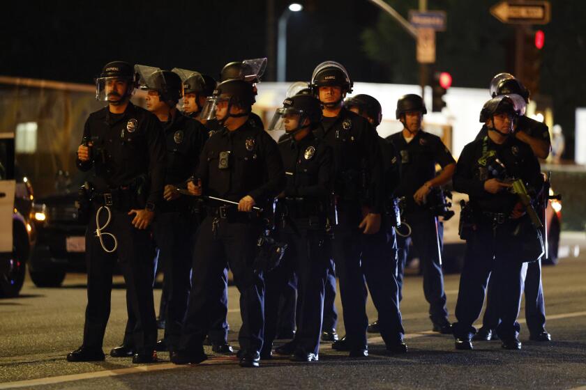 Federal judge bars the LAPD's use of some 'less-lethal' weapons at protests