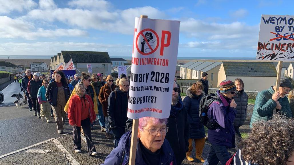 Residents march to protest against incinerator plan