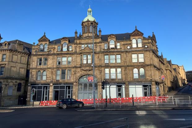 Roller shutter storage 'shed' built next to grand listed building in ...