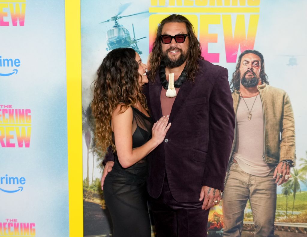 Jason Momoa and girlfriend Adria Arjona pack on the PDA on red carpet