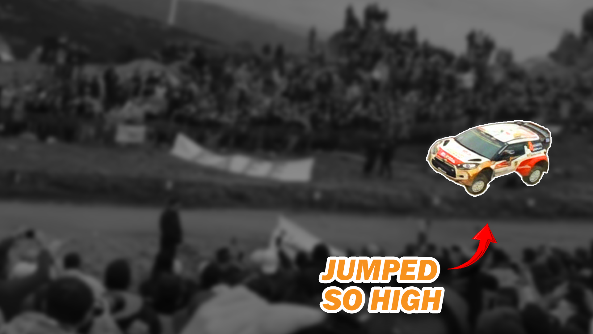 A rally car flies high while crossing the track