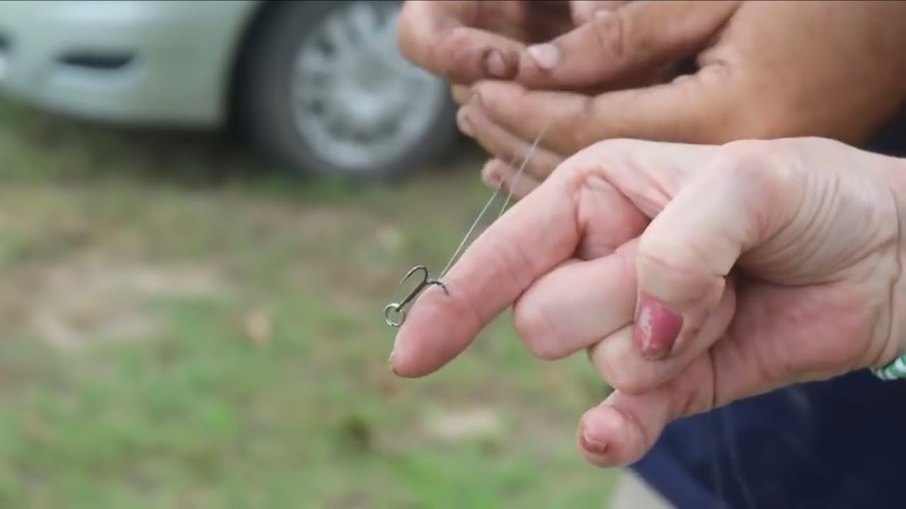 Expert demonstrates how to safely remove a hook from grandma
