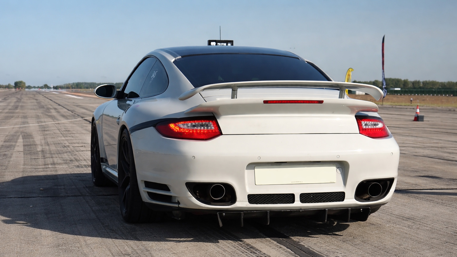 Exotic and tuned cars compete in straight-line sprints