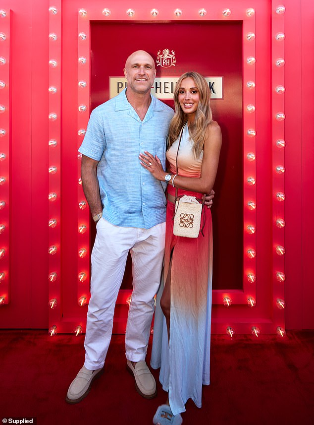 Bec Judd flashes her belly at Australian Open with husband Chris