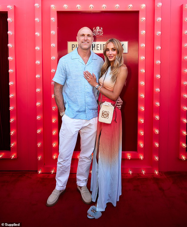 Bec Judd flashes her belly at Australian Open with husband Chris