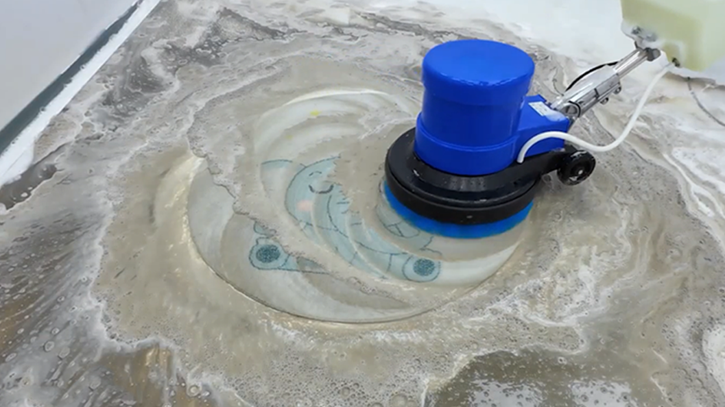 Slow rotary cleaning reveals hidden rug patterns