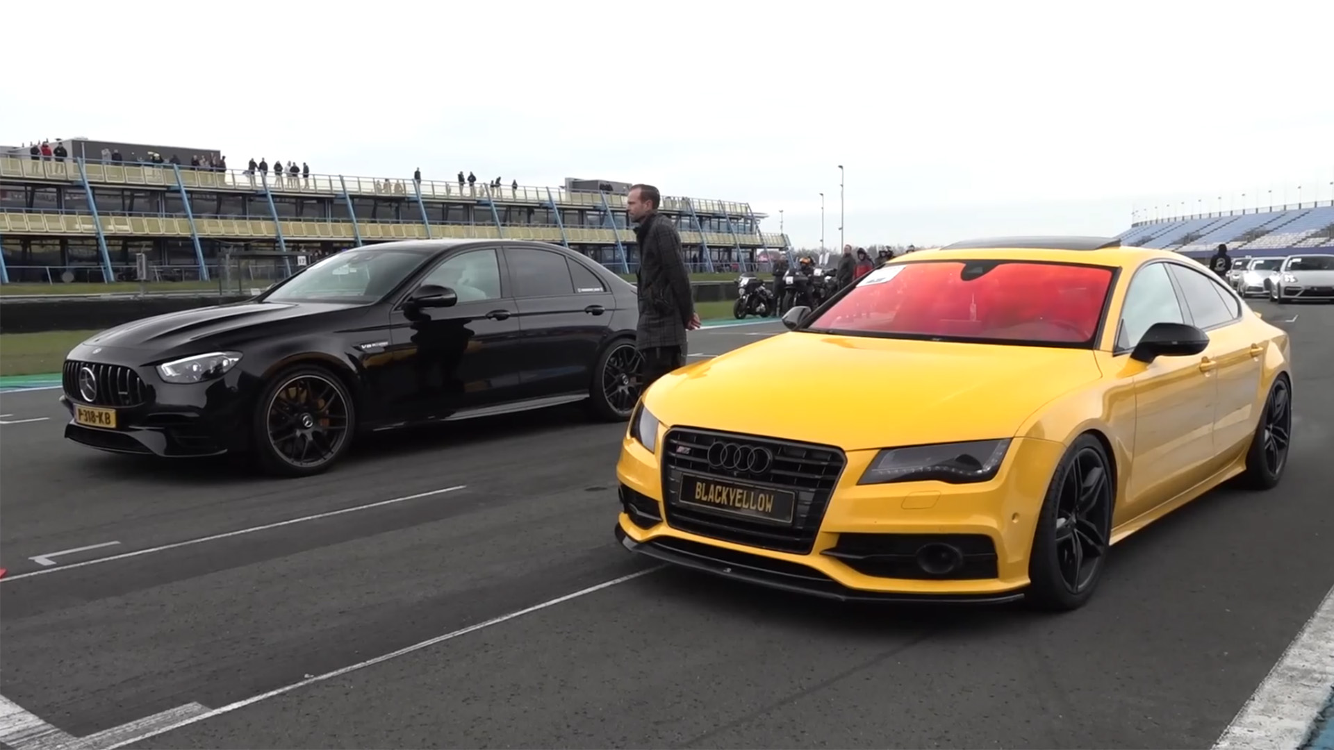 Modified cars compete in thrilling head to head races