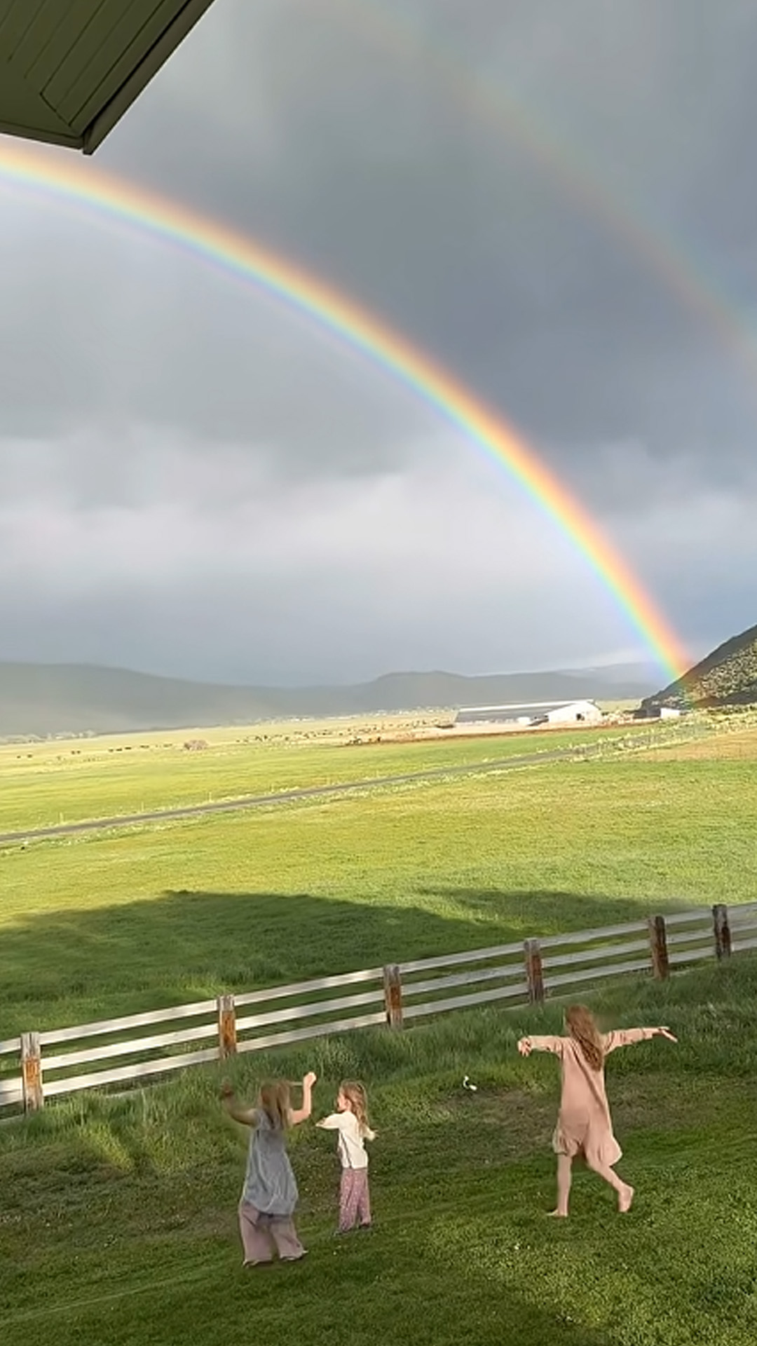 A rainbow decorates the sky