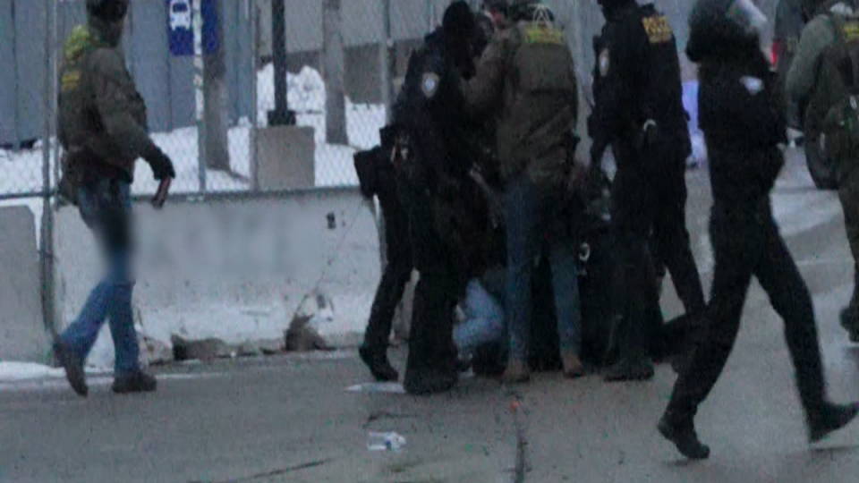 Video appears to show DHS agent kneeing person in face