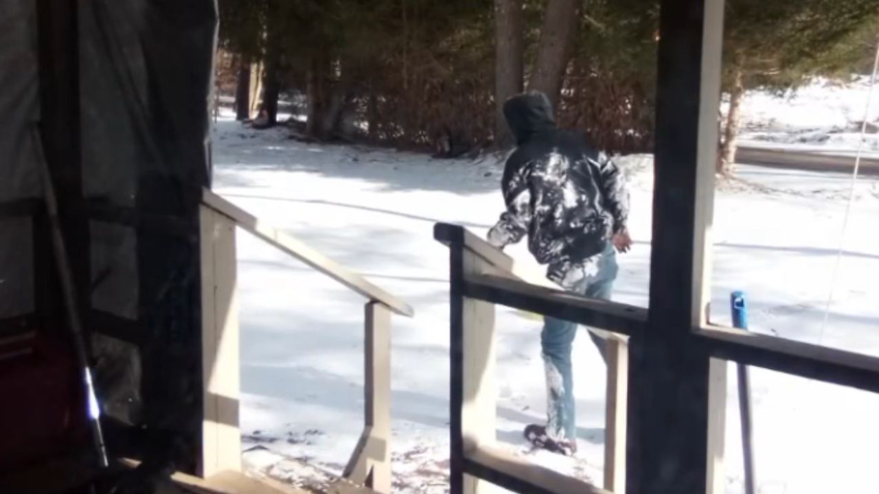 Epic fall: Man slips on ice right outside his home