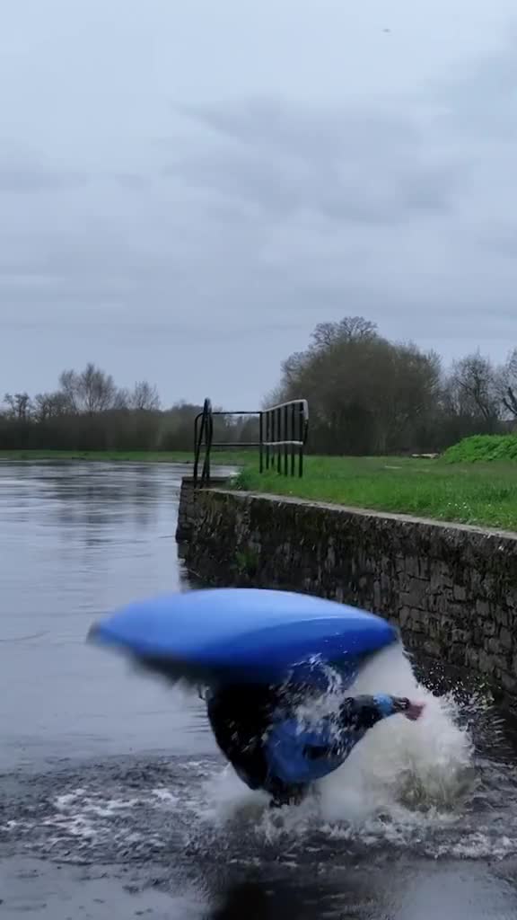 Launching a kayak pogo flip off the canal wall