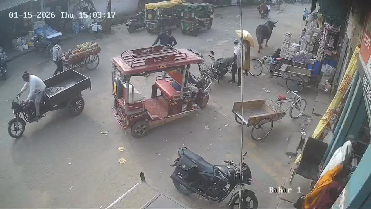 Shocking CCTV: Stray bull hurls woman to the ground near SBI branch in ...