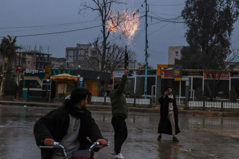 Calls for 'united Syria' on the streets of Raqqa after end of Kurdish ...