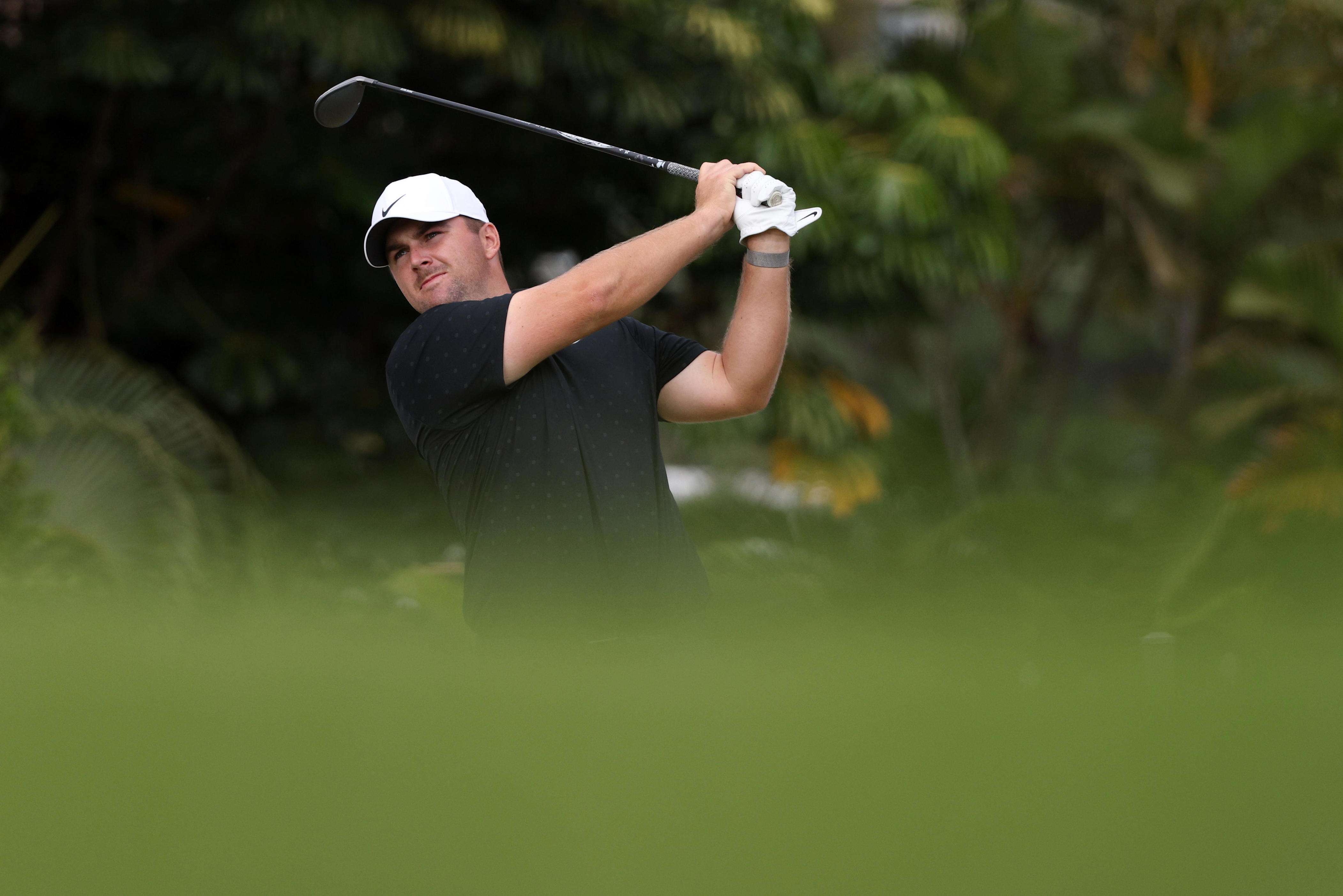 Who leads the PGA Tour money list going into the The American Express