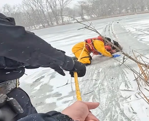 Public safety officers rescue fisherman from icy water in heroic ...
