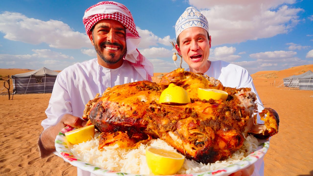 Cooking a whole lamb beneath sand dunes in the Omani desert
