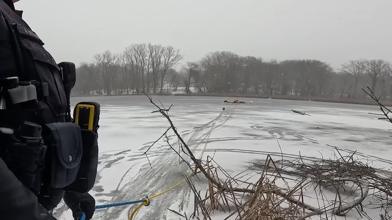 Police officers rescue fisherman stranded on frozen lake in Michigan