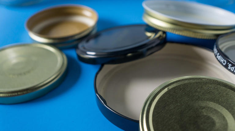 Repurpose jar lids into a unique and artsy countertop staple