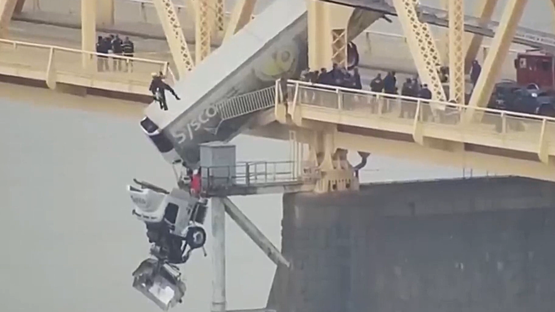 Woman’s crash nearly sends semitruck off bridge