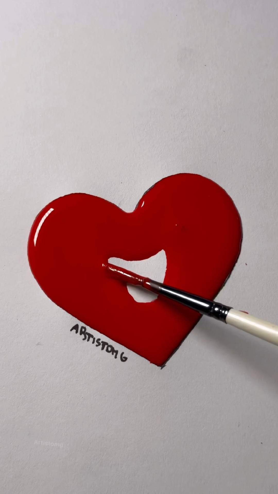 Making art using red paint markers