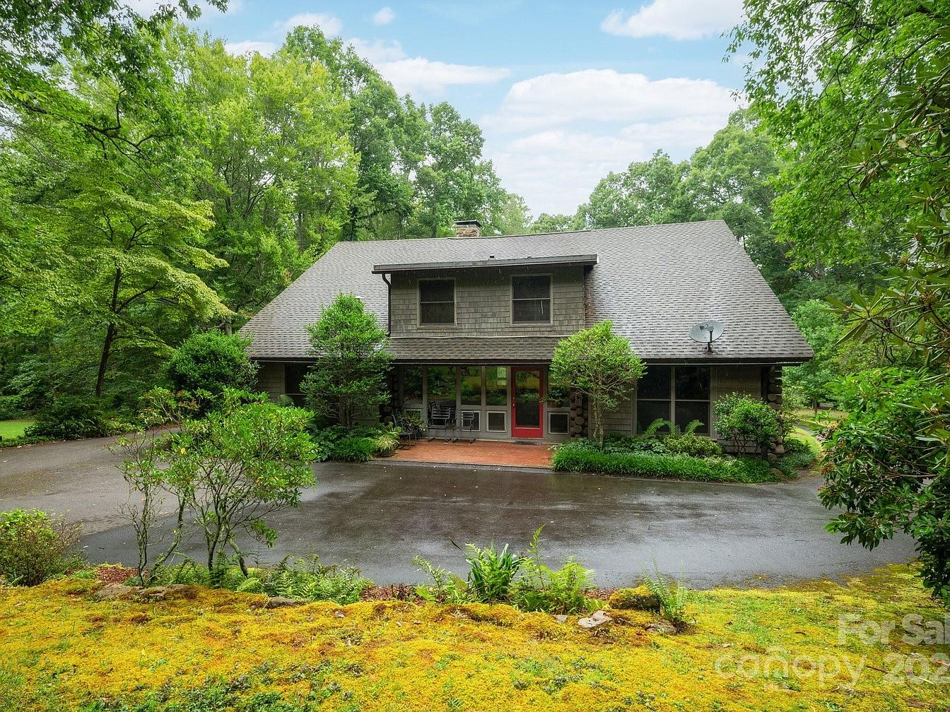 Historic 1915 log home in Arden, North Carolina, featuring 26 acres, a ...