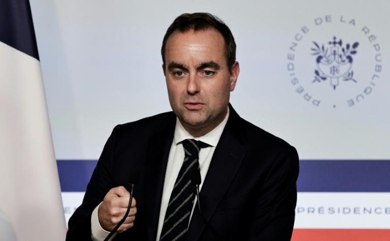 France PM to force budget into law, concedes 'partial failure'