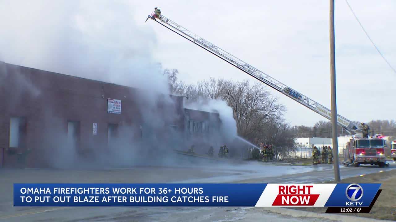 Crews still working to extinguish hot spots at warehouse fire in Omaha