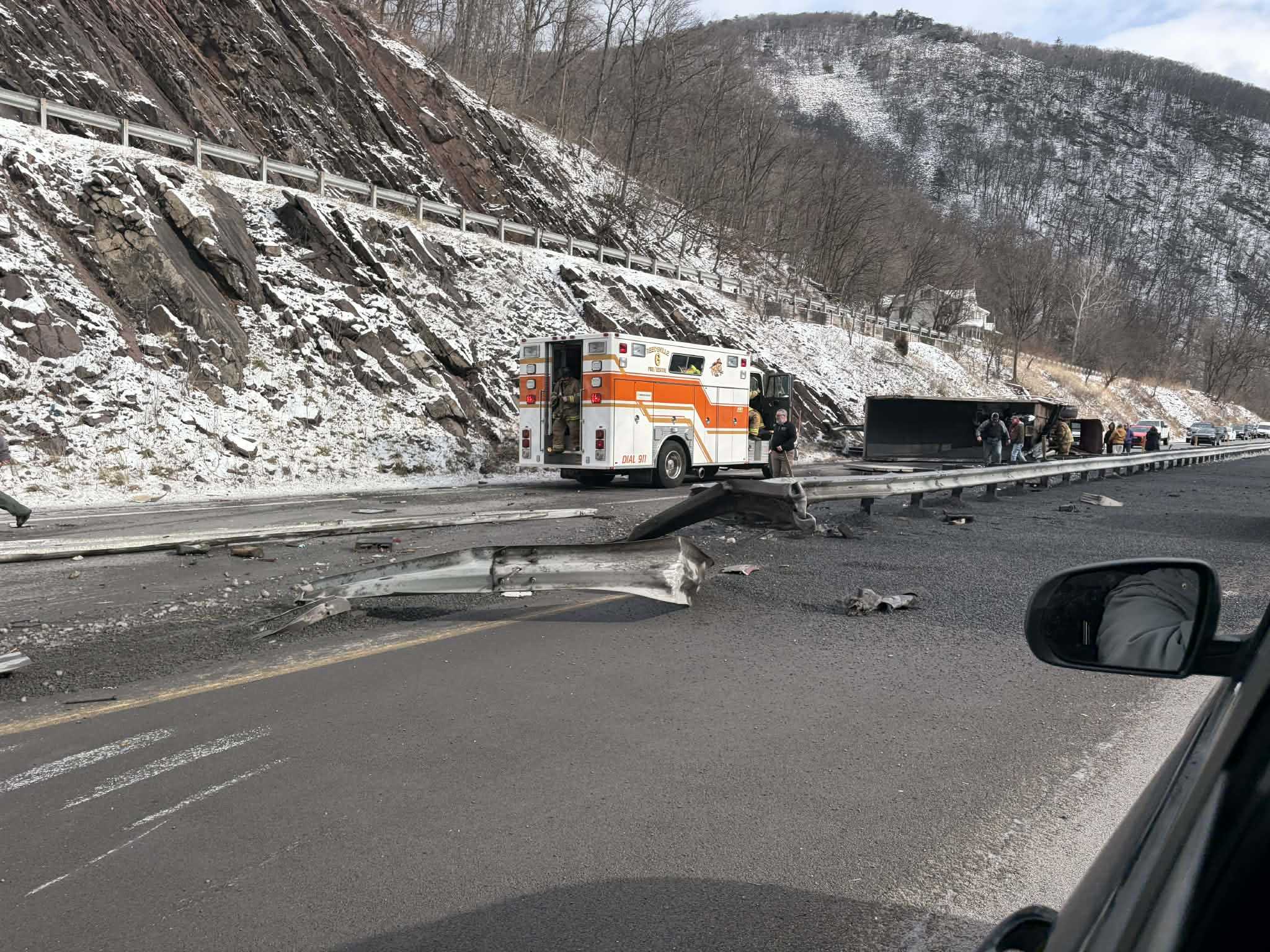 Dump truck carrying stones flips over | Photos