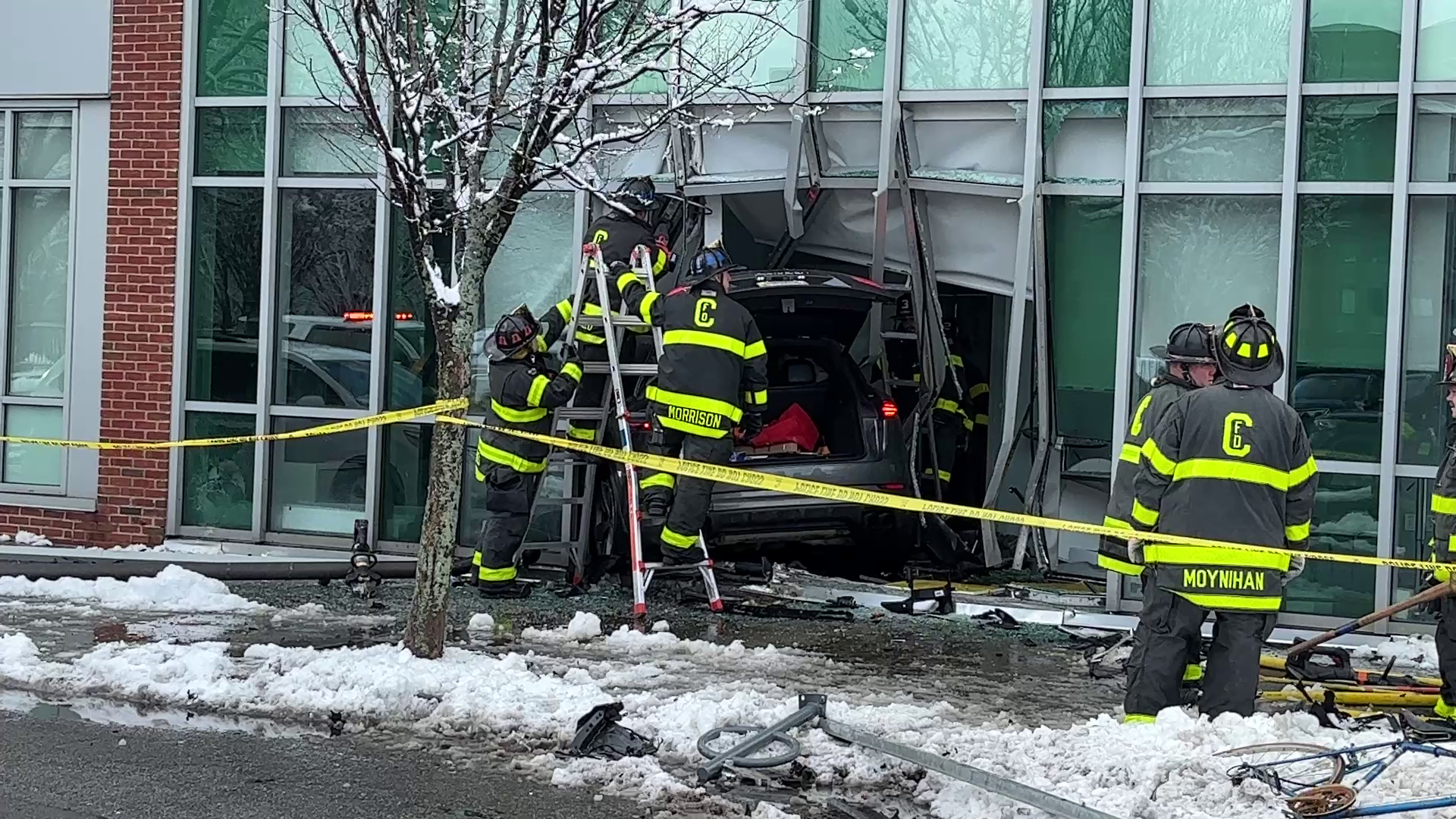 Two injured after stolen car crashes into building, police say