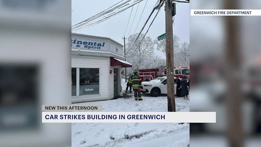 Icy conditions blamed as car smashes into Greenwich building