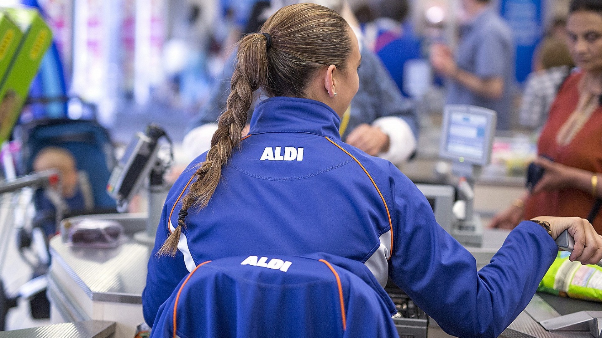 The real reason Aldi cashiers sit behind the register