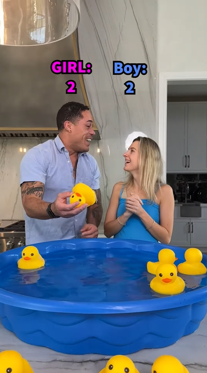 Baby gender surprise in a rubber duck pond