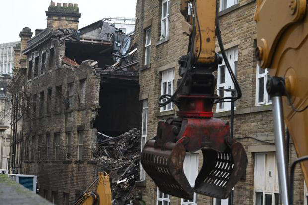 Demolition work continues on collapsed Bradford building as excavator ...