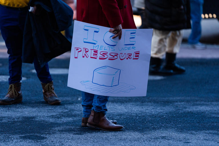 Hundreds march to celebrate MLK — and protest Trump