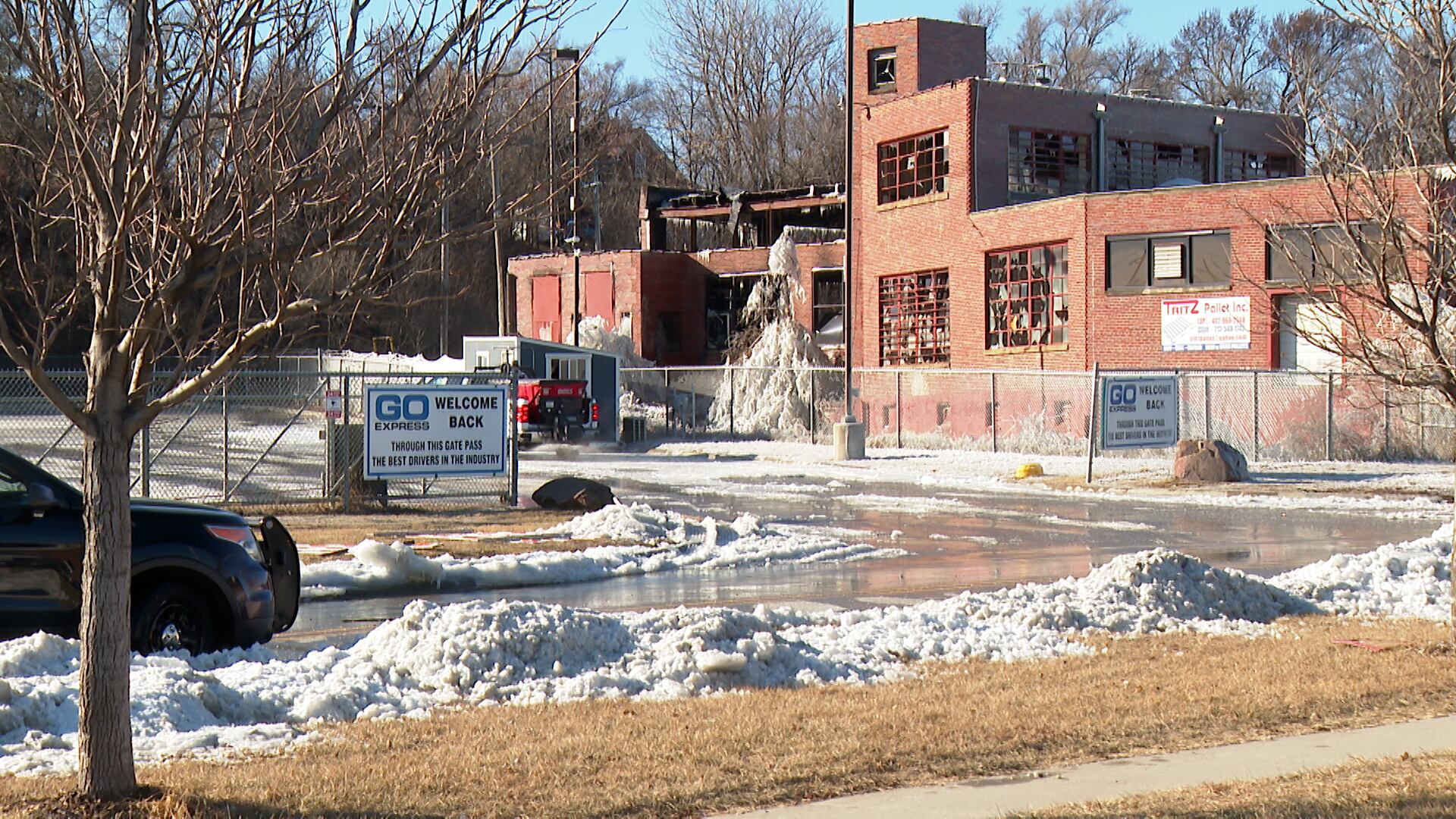 Crews continue to monitor fire at South Omaha warehouse