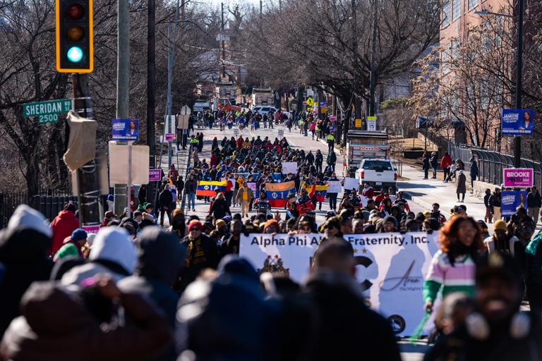 Hundreds march to celebrate MLK — and protest Trump
