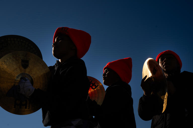 Hundreds march to celebrate MLK — and protest Trump