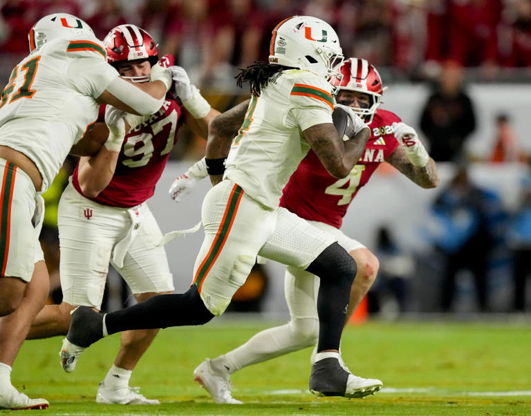 Mark Fletcher Jr. throws punch at Indiana player, hugs Fernando Mendoza ...