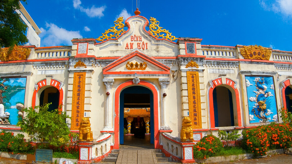 A walk past an ornate temple gate in Vietnam