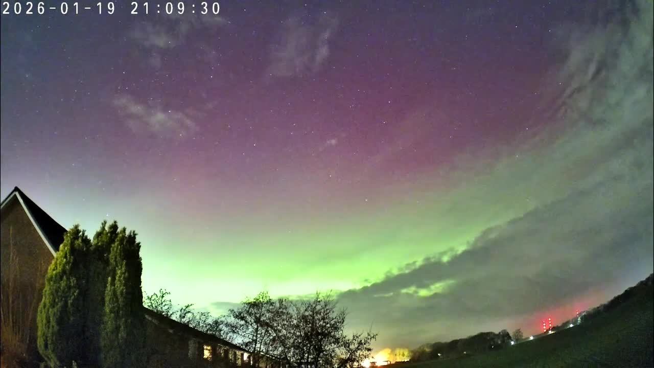 Aurora borealis illuminates purple and green light over England's northwest