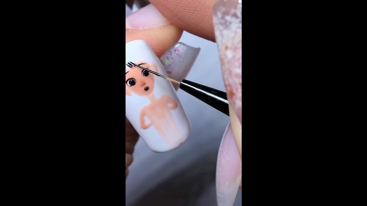 Creating cartoon girl nail art with white and orange colors