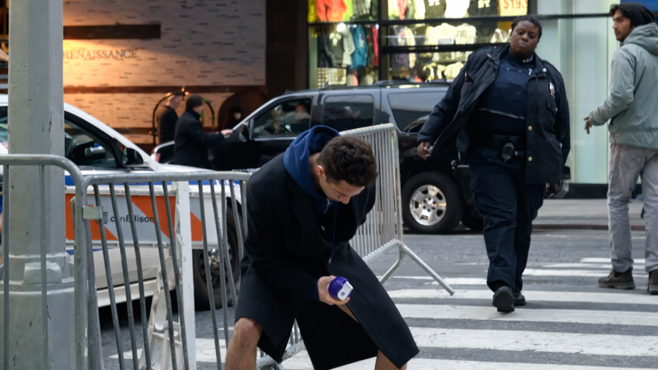 Shaking a protein bottle in front of police officers