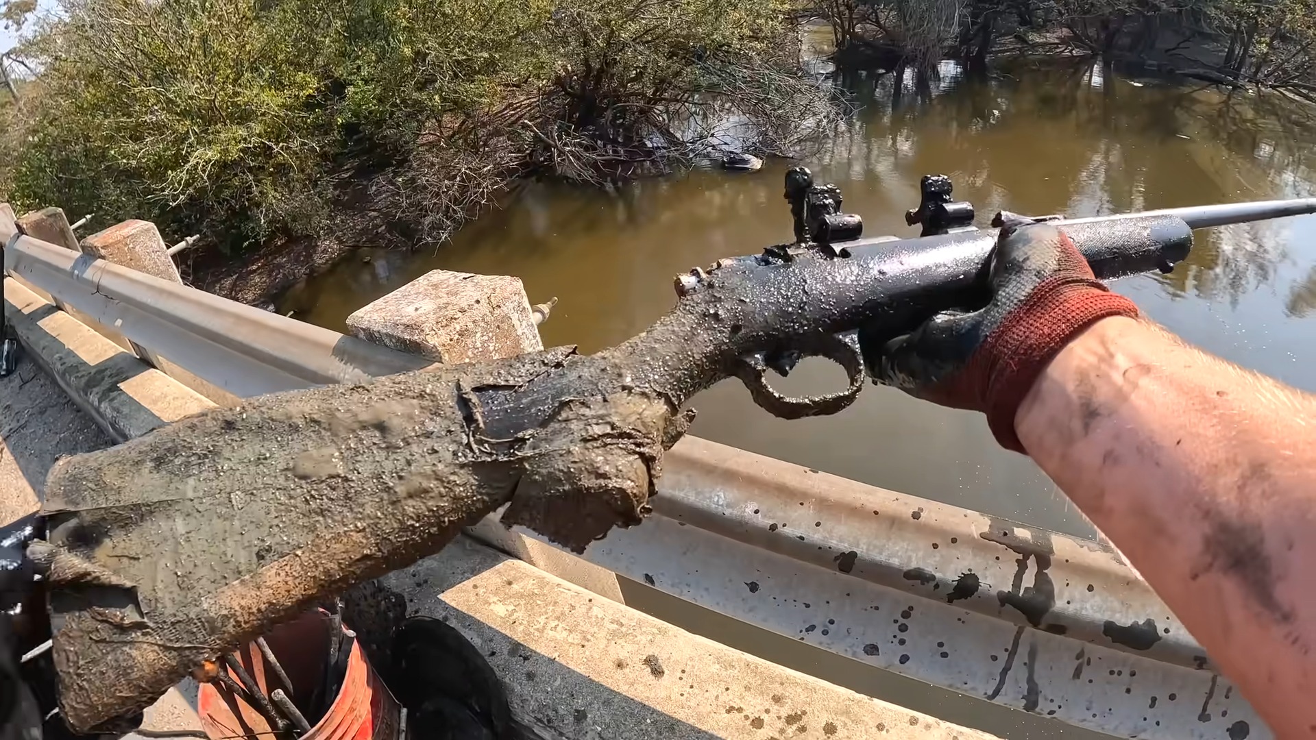 Sniper-style rifles were pulled from the water… police were stunned