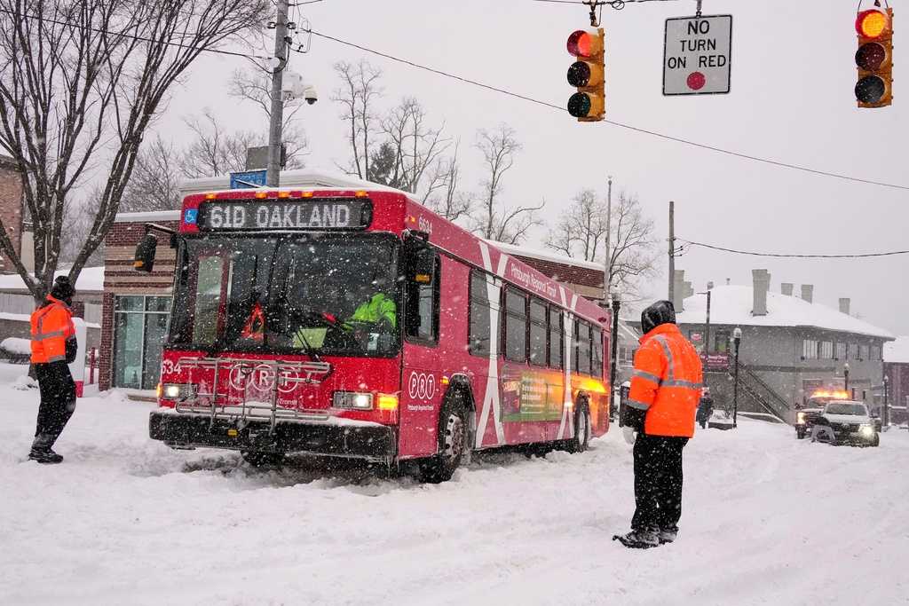 PRT clearing snow from bus stops after winter storm