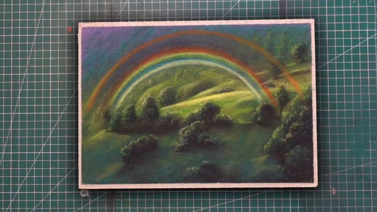 Draw a realistic rainbow with pastels light mist and soft edges